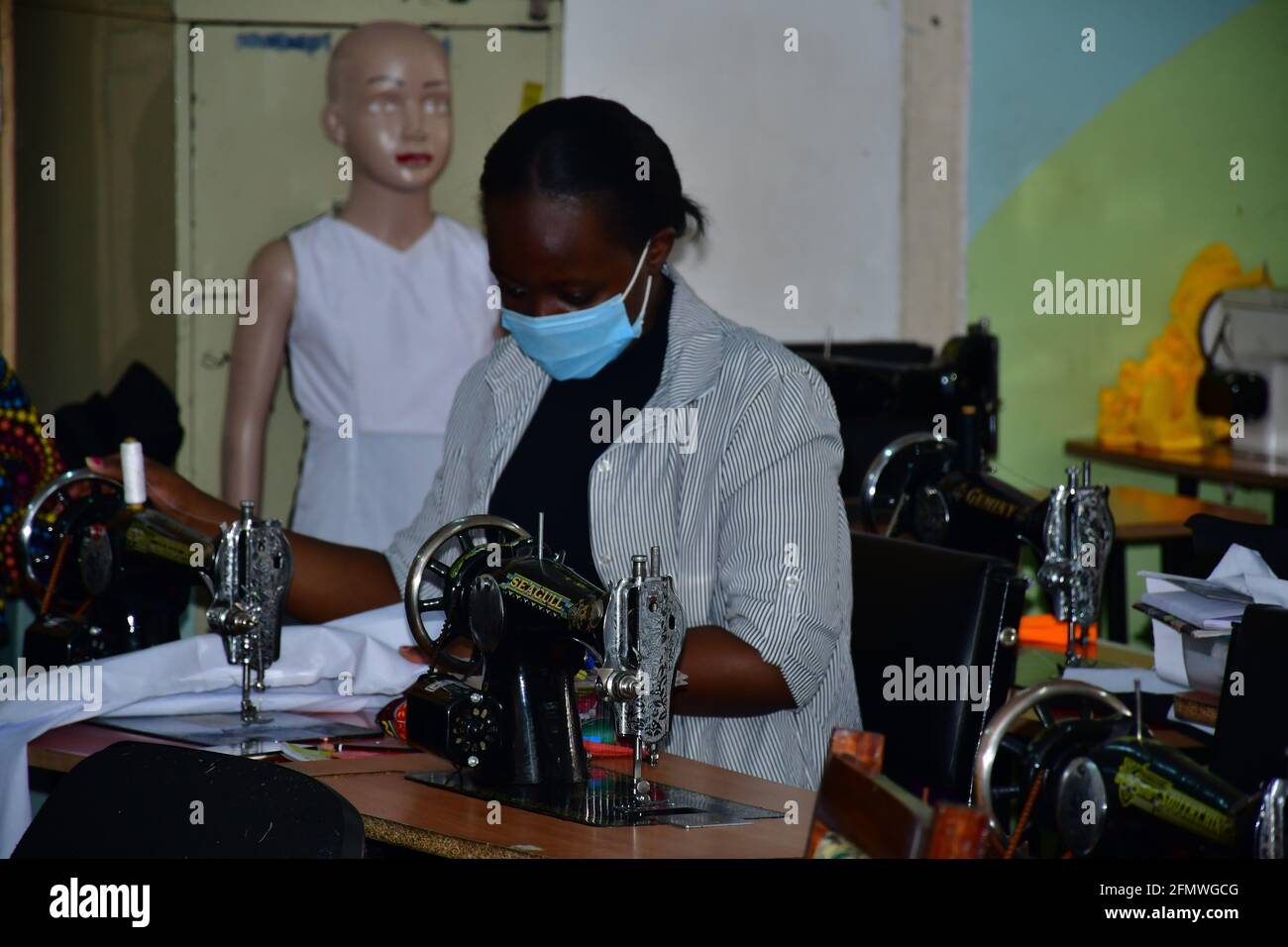 African seamstress sews clothes. Workplace of tailor Stock Photo - Alamy