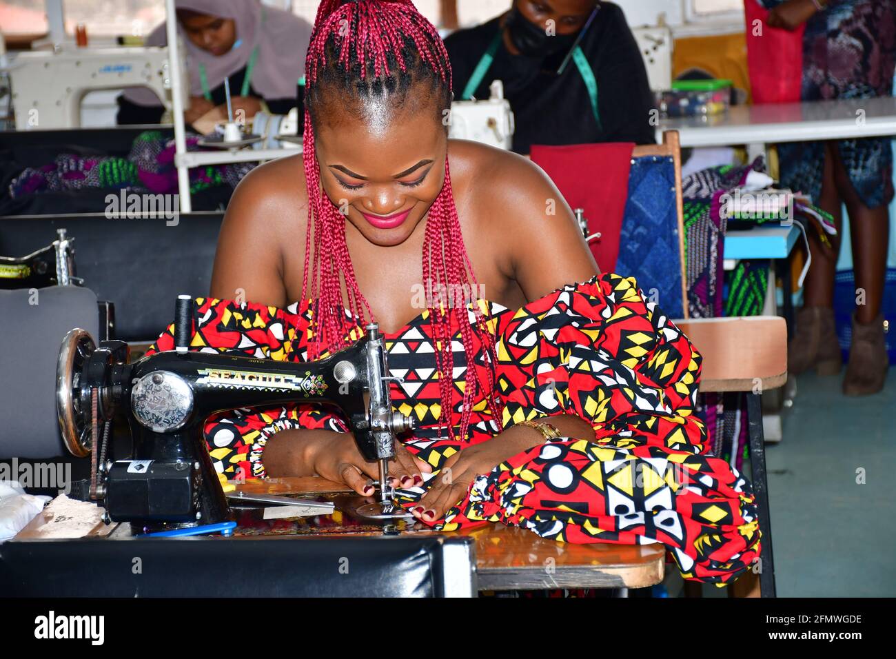 African seamstress sews clothes. Workplace of tailor Stock Photo - Alamy