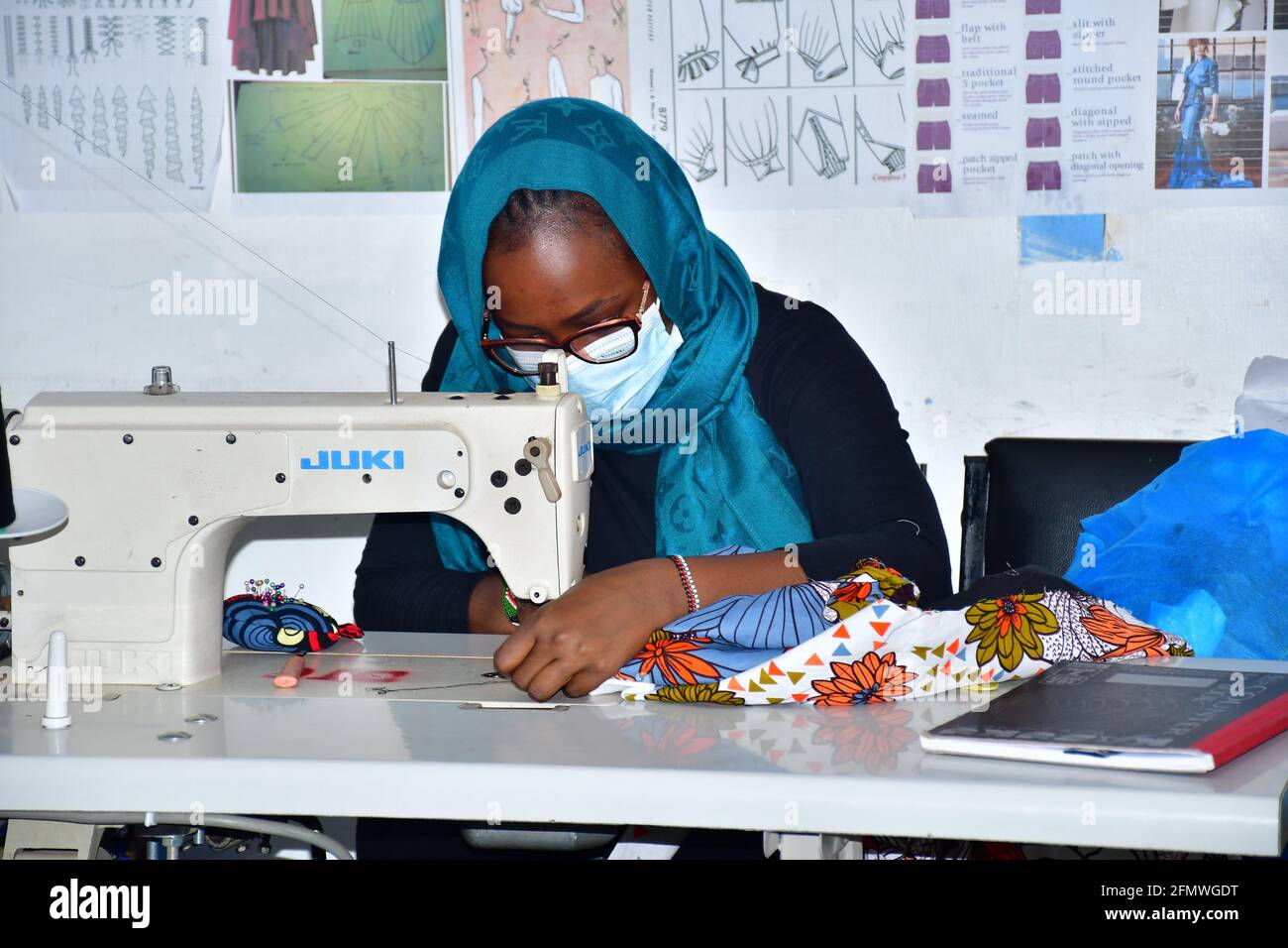 African seamstress sews clothes. Workplace of tailor Stock Photo - Alamy