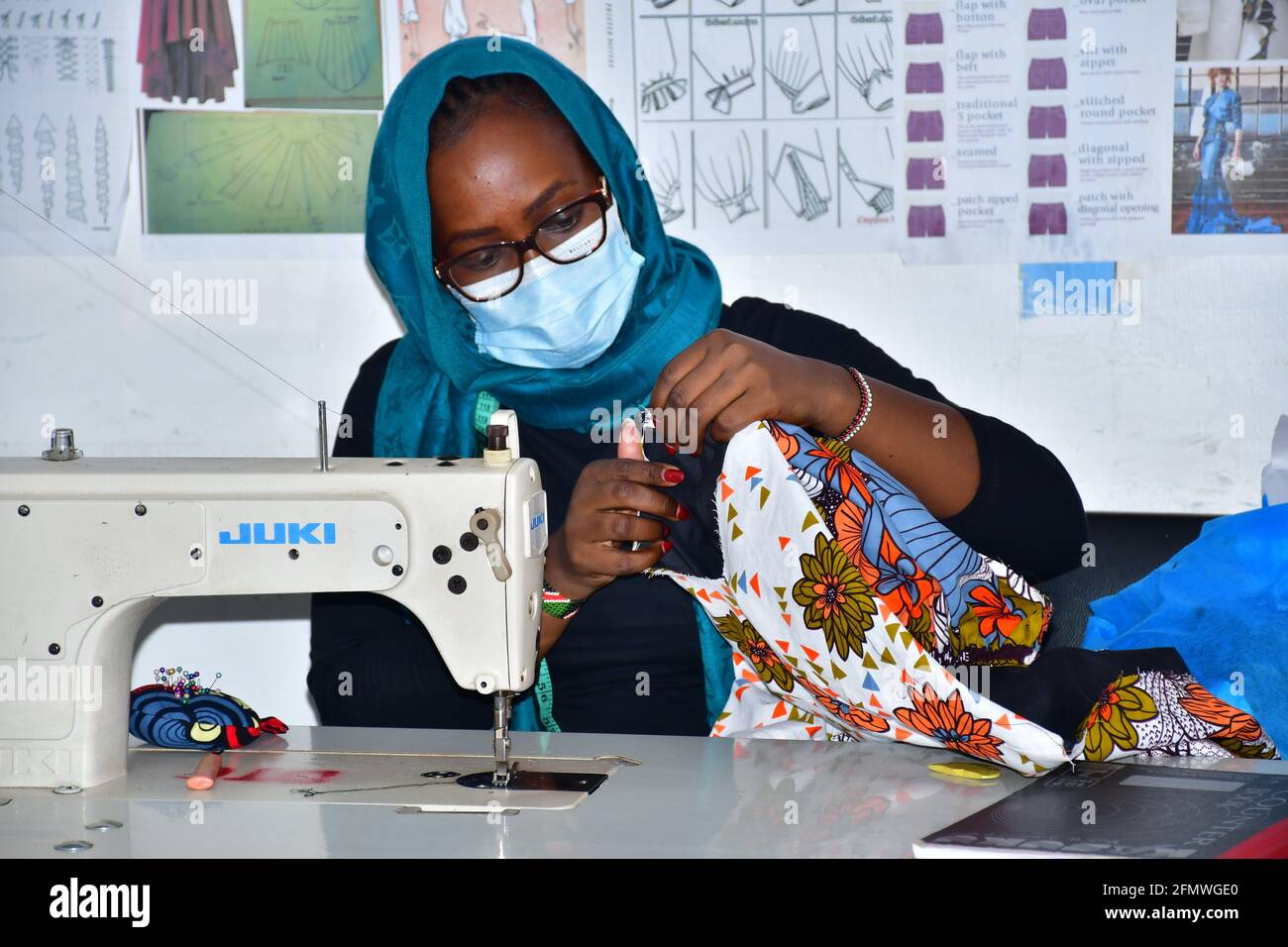 African seamstress sews clothes. Workplace of tailor Stock Photo - Alamy