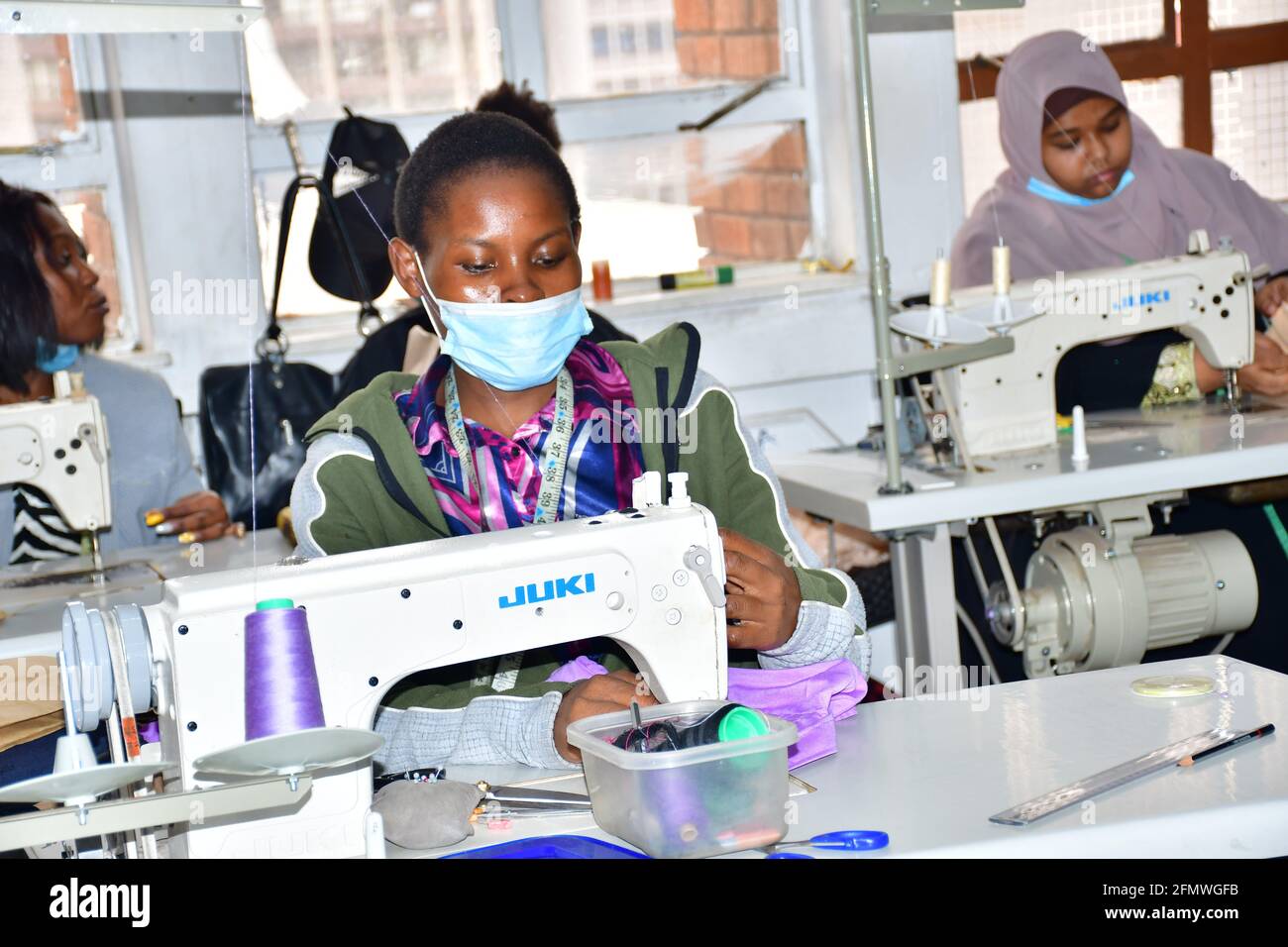 African seamstress sews clothes. Workplace of tailor Stock Photo - Alamy