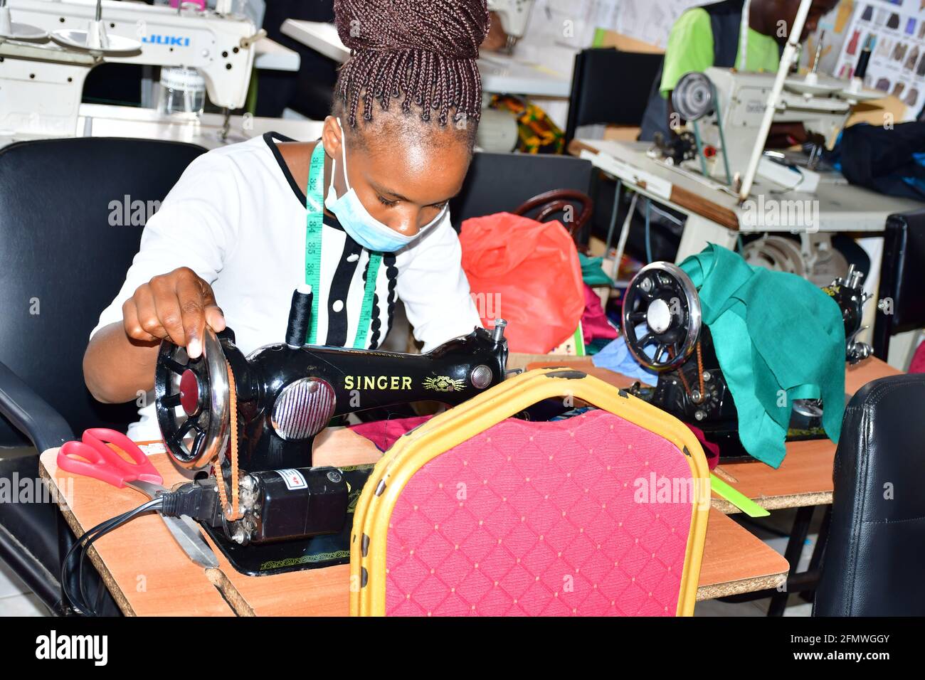 African seamstress sews clothes. Workplace of tailor Stock Photo - Alamy