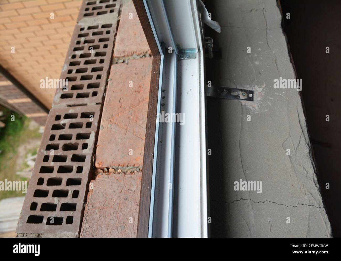 Plastic window installation: a close-up on uPVC window frame without ...