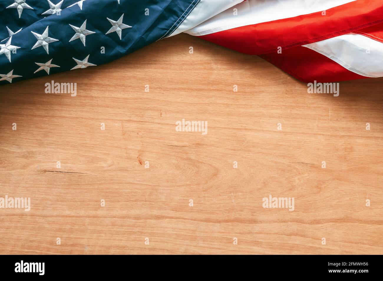 Twisted USA flag on wooden background as copy space, top view flat lay ...