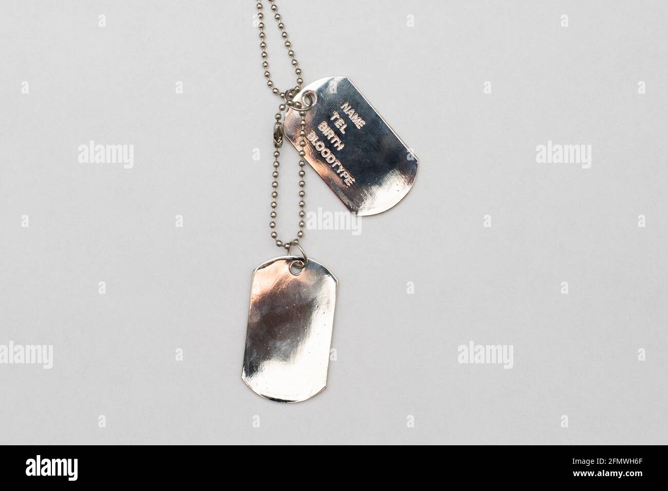 Shiny Blank Metallic Military Identification Plate on White Background Stock Photo - Alamy