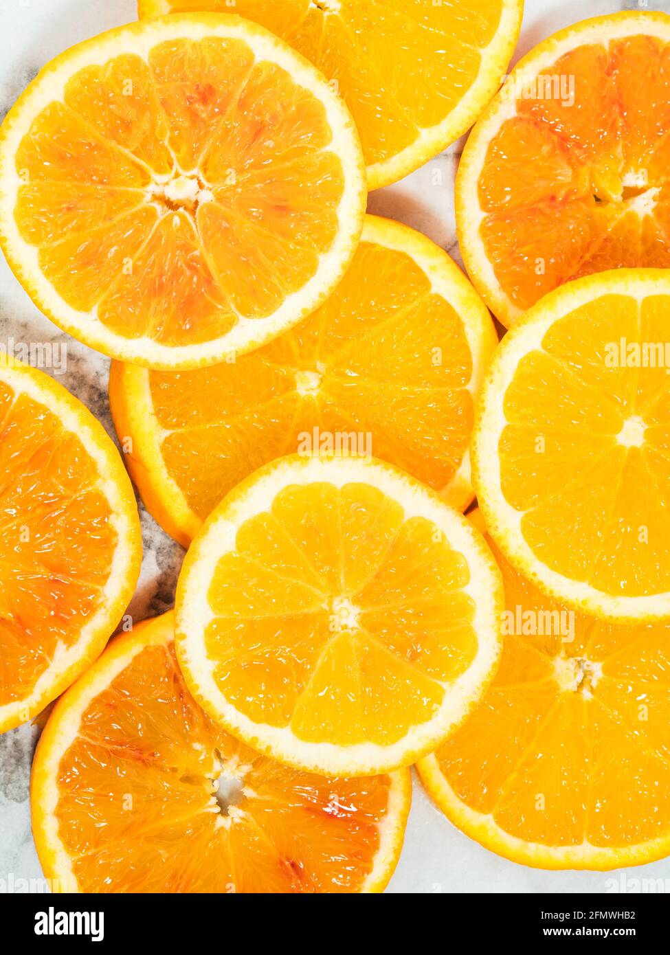 Colorful orange citrus slice fruit texture background on white marble ...