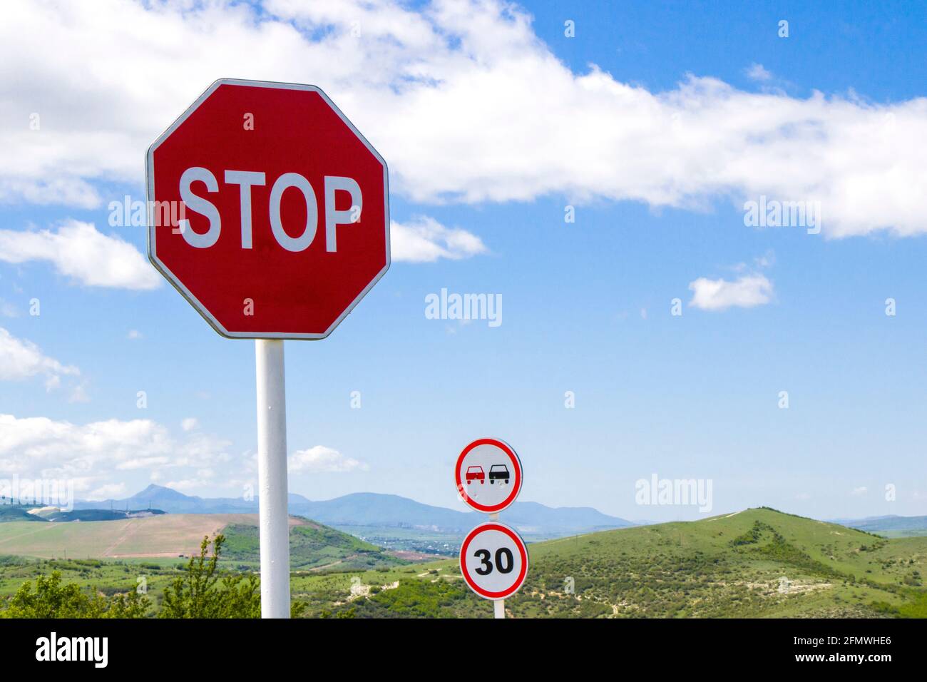Stop sign on the road, red stop sing on the highway in Didgori, Georgia ...