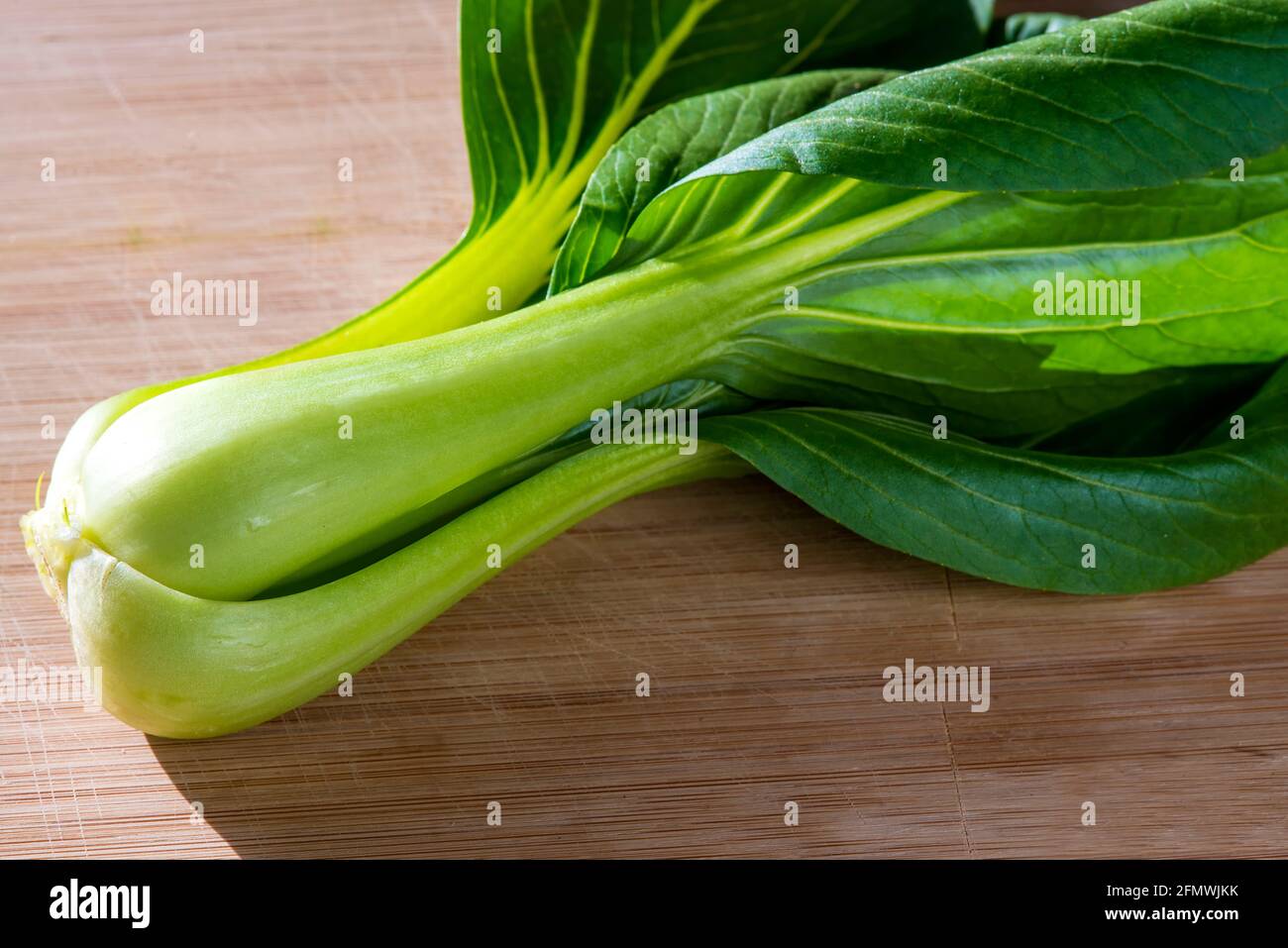 Pak choi, Chinese vegetable on a plank Stock Photo - Alamy