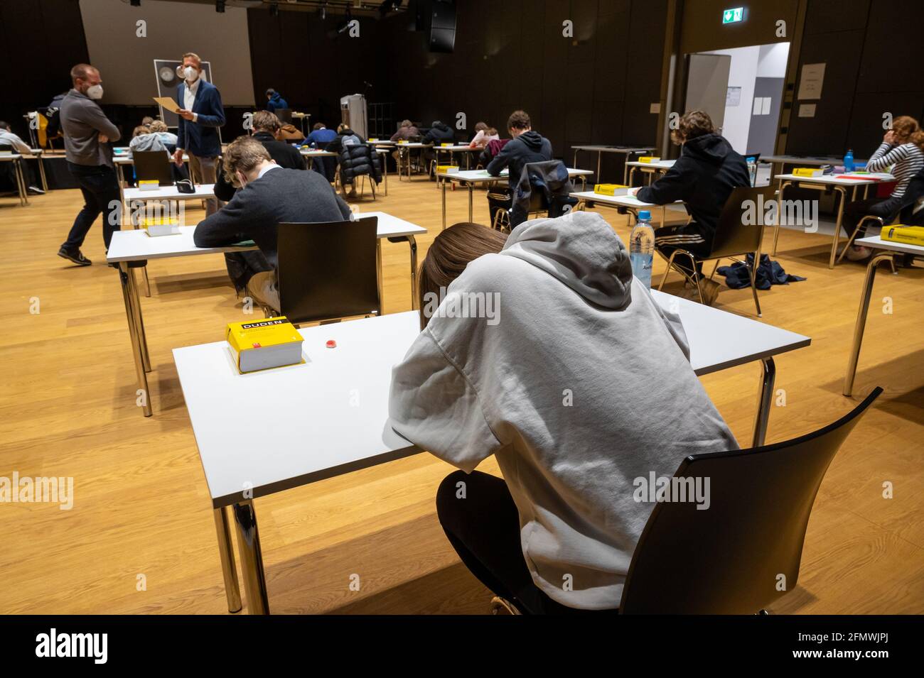 Munich, Germany. 12th May, 2021. Students sit under the supervision of ...