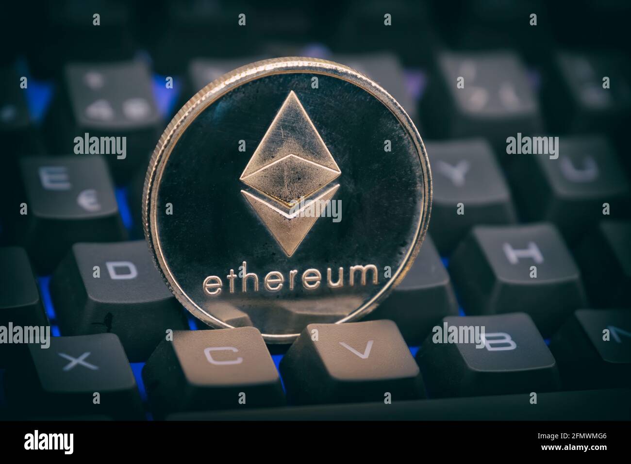 Physical Ethereum Coin Between The Keys Of A Computer Keyboard Stock ...