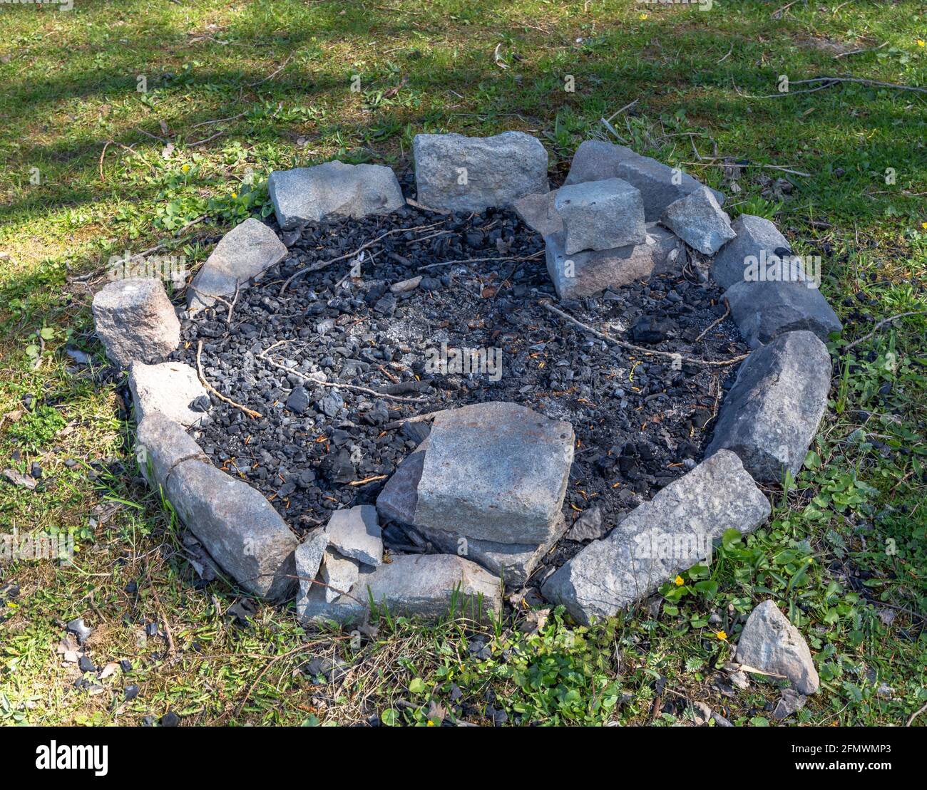 Extinguished fire pit for an outdoor campfire Stock Photo - Alamy