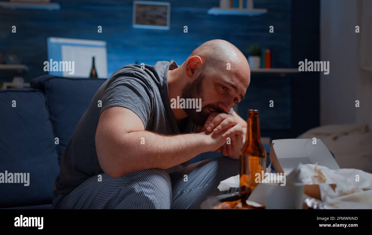 Sad depressed man crying feeling loneliness, chronic fatigue upset ...