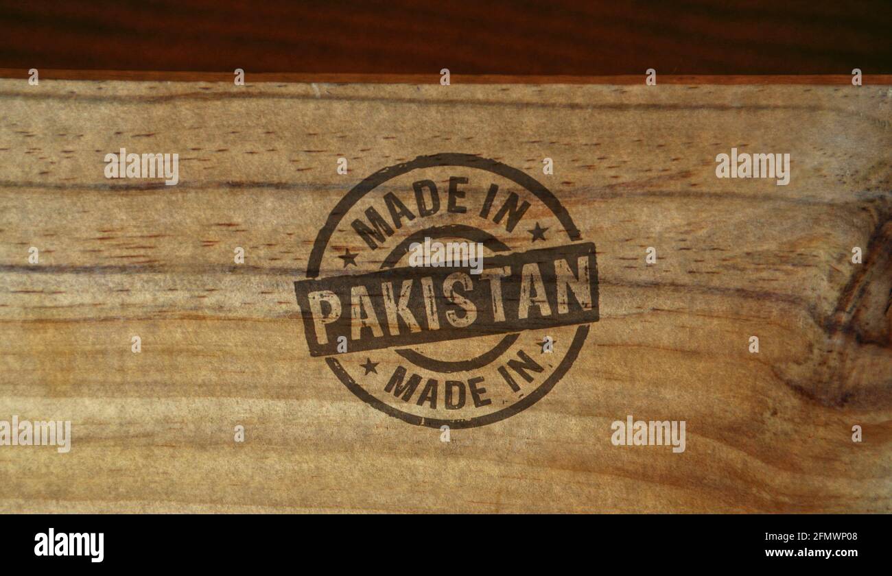 Made in Pakistan stamp printed on wooden box. Factory, manufacturing ...