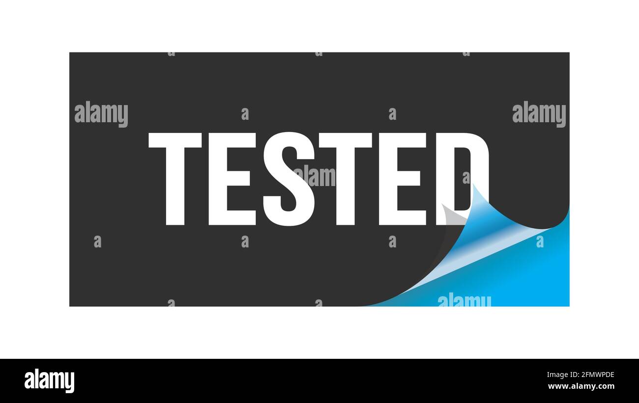 TESTED text written on black blue sticker stamp Stock Photo - Alamy