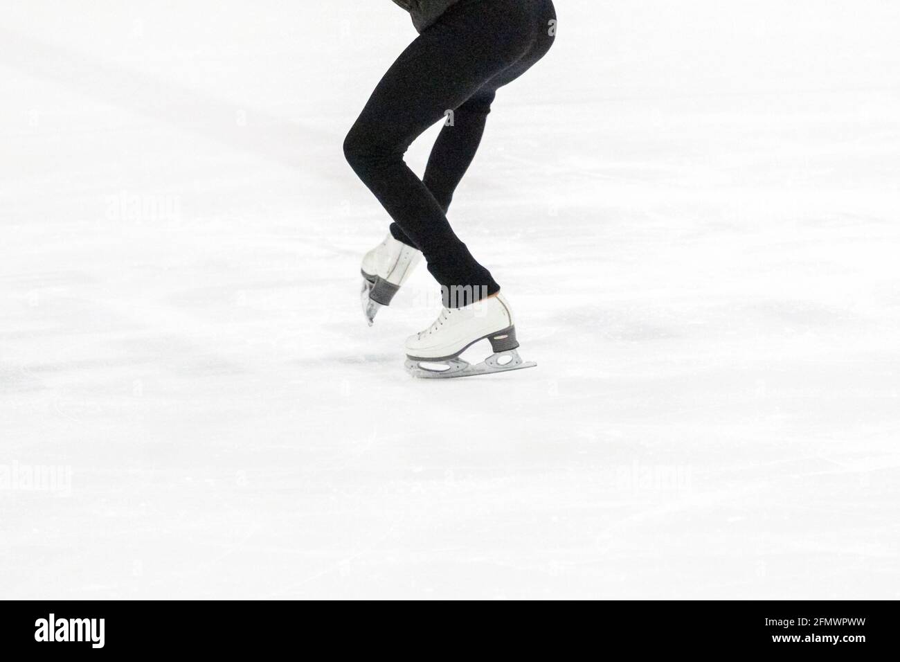 View of figure skater feet at the figure skating practice Stock Photo ...