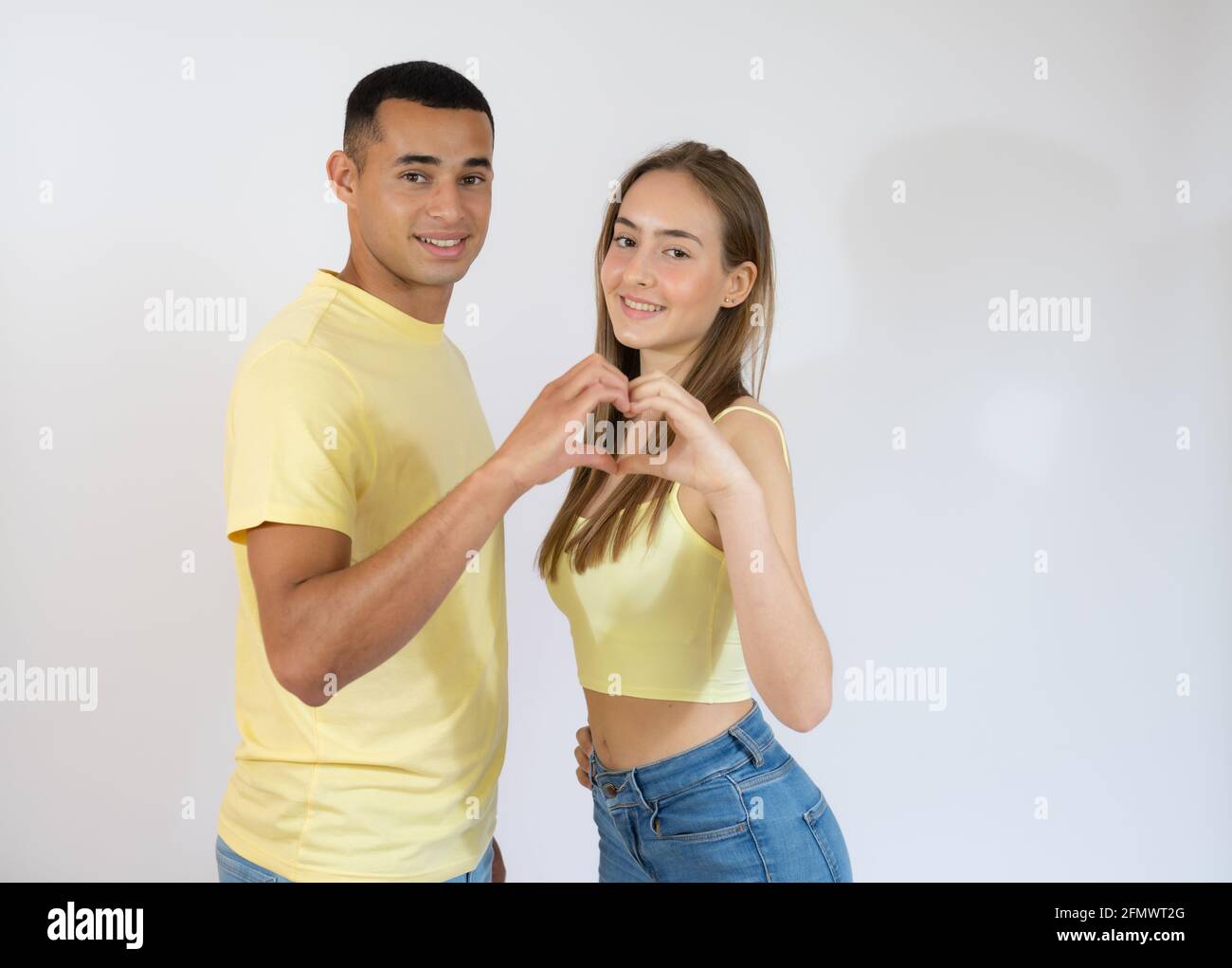 Photo of two charming couple making hands fingers heart figure over ...