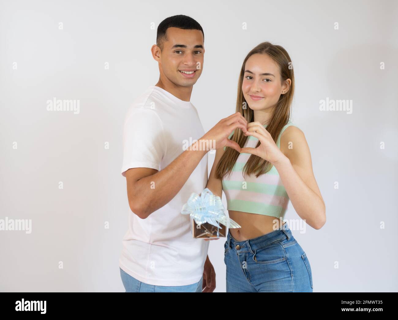 Photo of two charming couple making hands fingers heart figure over ...