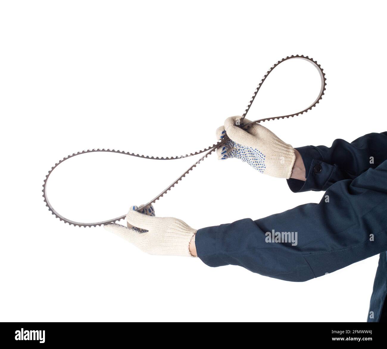 Auto locksmith holding a used timing belt on a white background ...