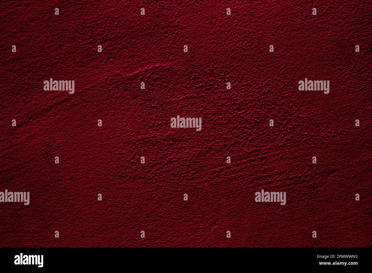 Crimson colored wall background with textures of different shades of ...