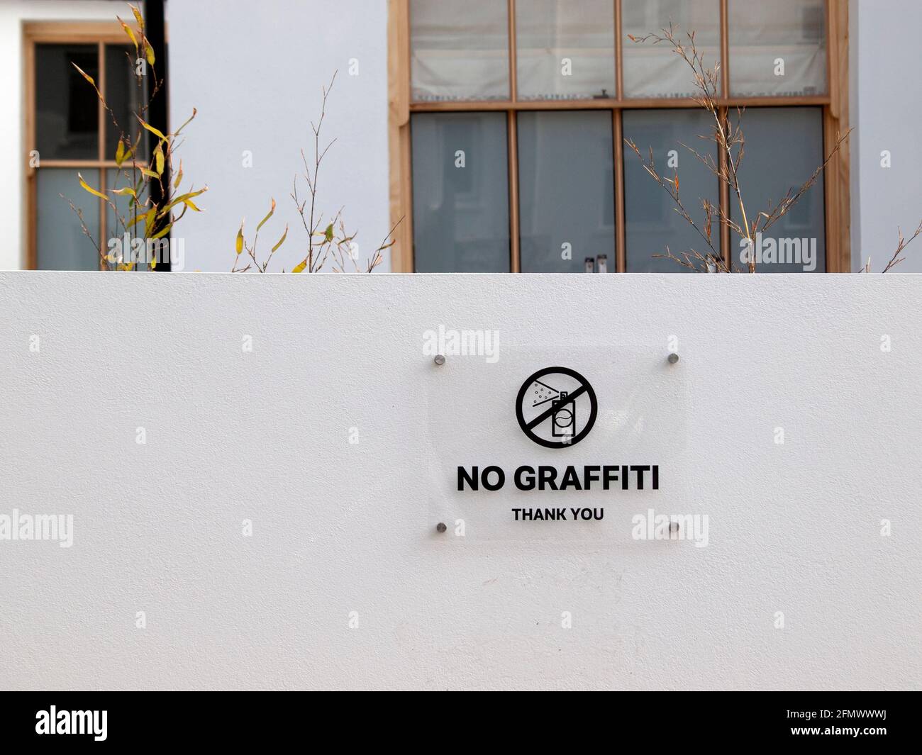 A request for no graffiti on a Brighton street Stock Photo - Alamy