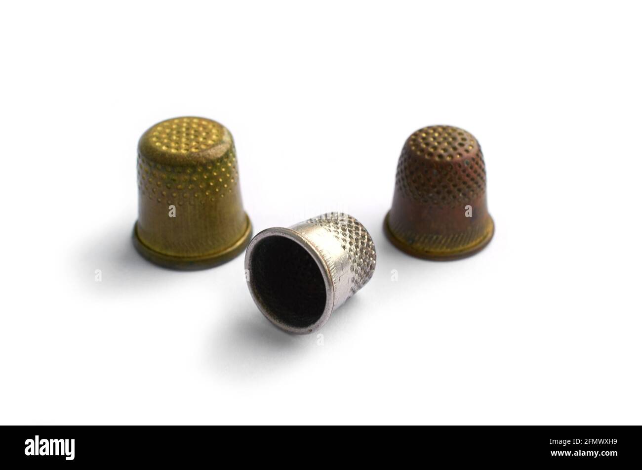 Three vintage thimbles isolated on a white background with shadow Stock ...