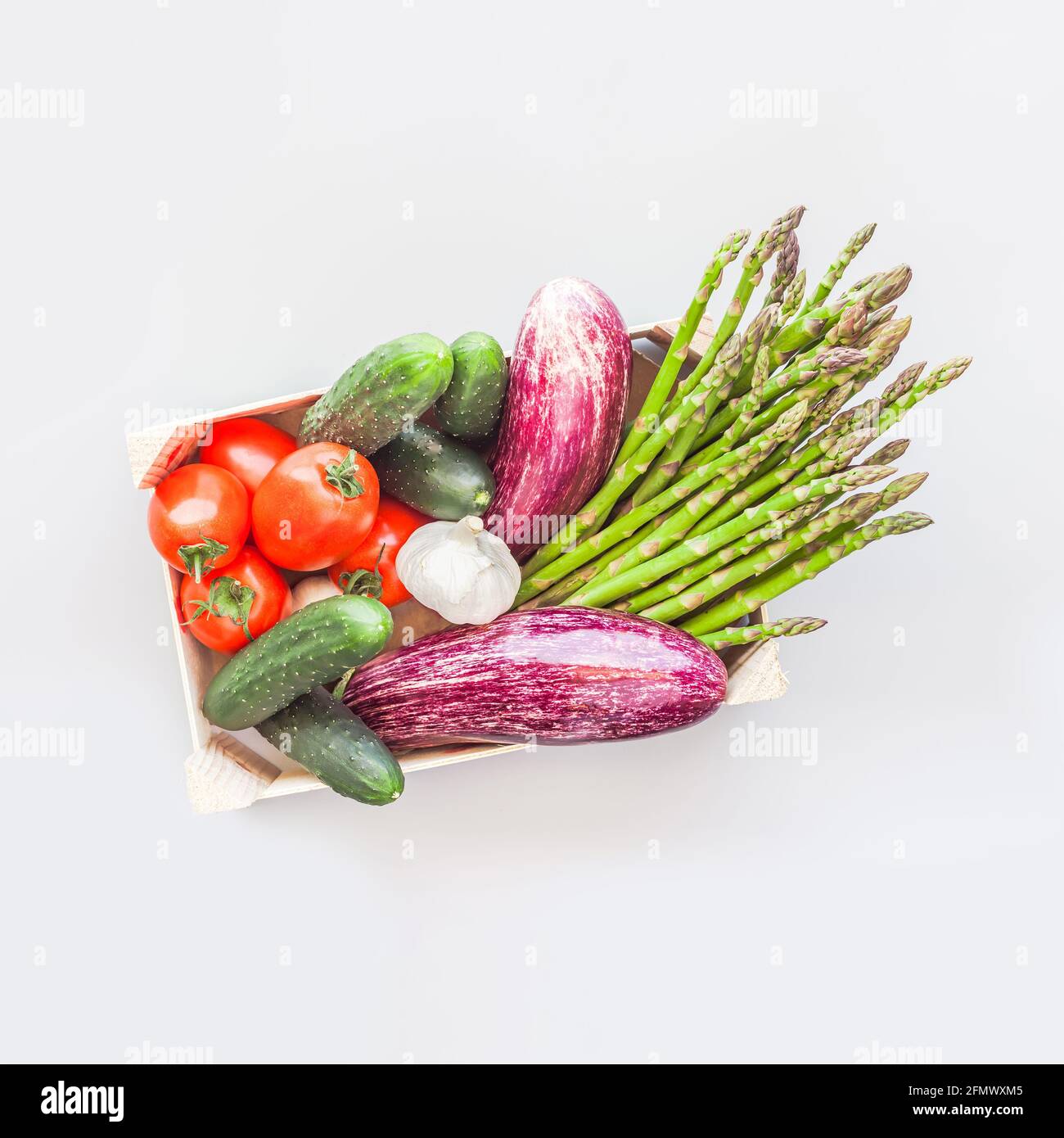 Fresh organic vegetables in eco friendly wooden box flat lay, top view ...