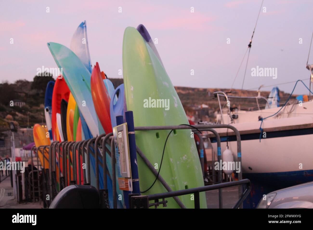 Surf Boards stacked up beside the waters edge Stock Photo - Alamy