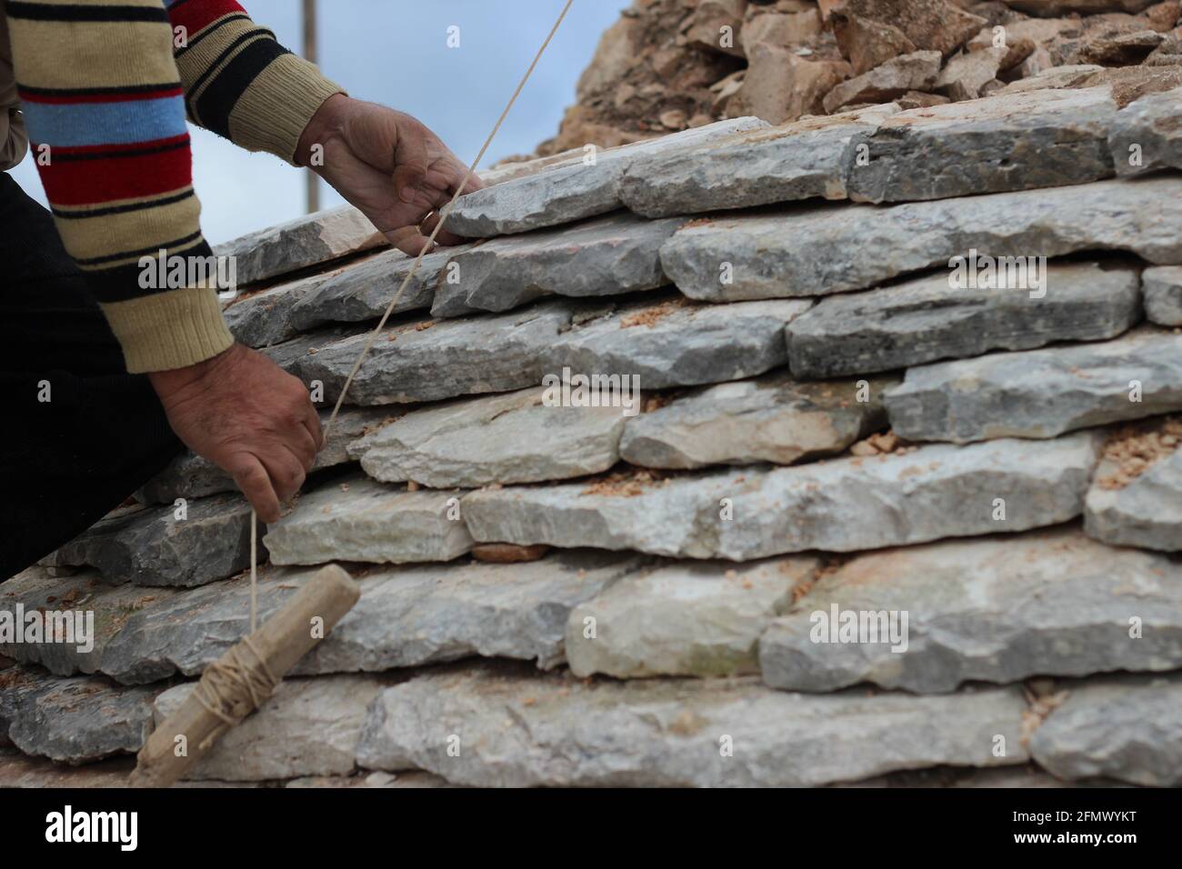 stone masonry wall building handmade craft traditional Stock Photo - Alamy