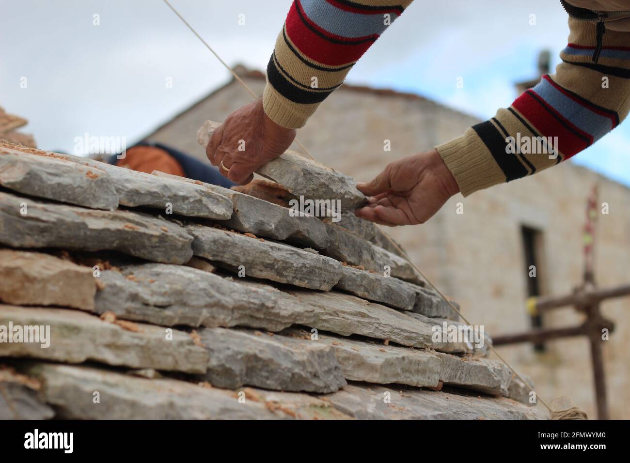 stone masonry wall building handmade craft traditional Stock Photo - Alamy