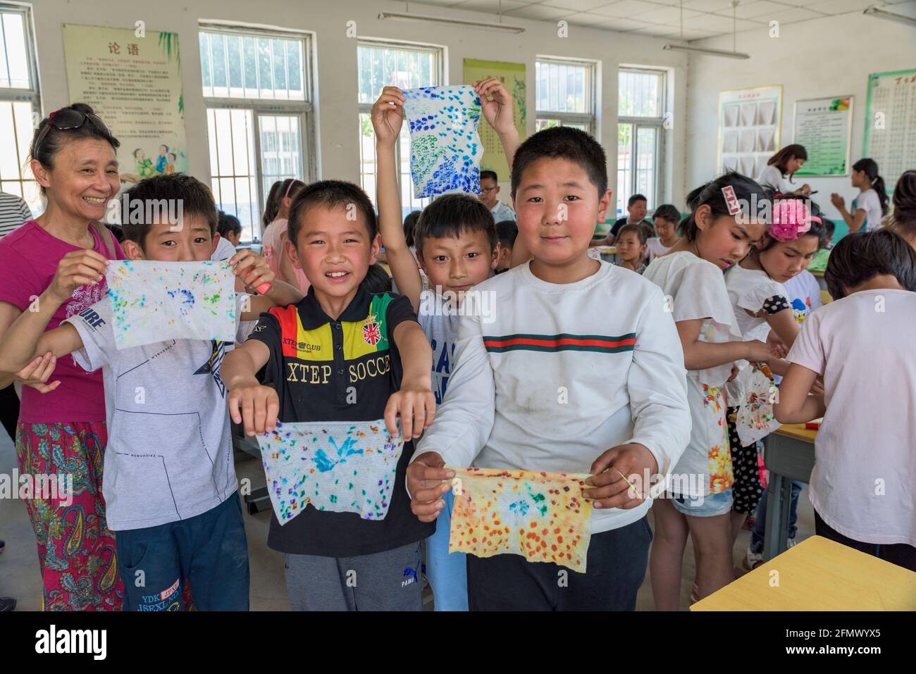 Students in a primary school in rural China working on an art and craft ...