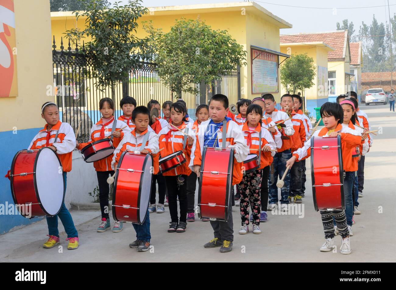 A primary school marching band welcoming guests to the school in rural ...