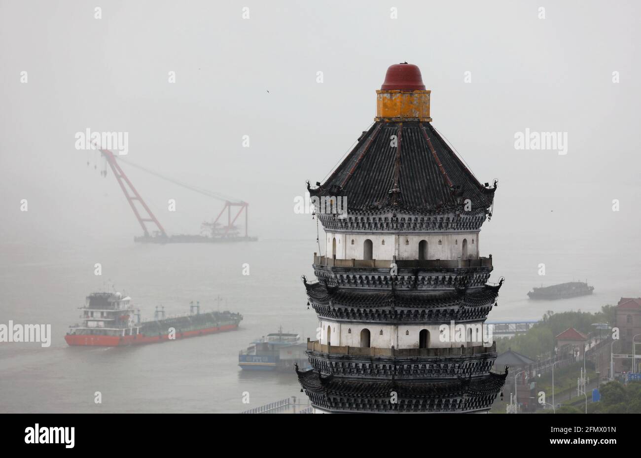 Anqing, China. 11th May, 2021. The tower spire of Zhenfeng Tower was ...