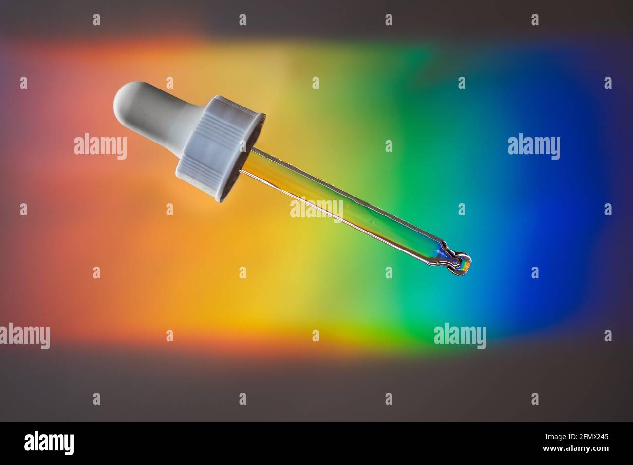 Levitating Glass dropper on a prism rainbow background. Futuristic ...