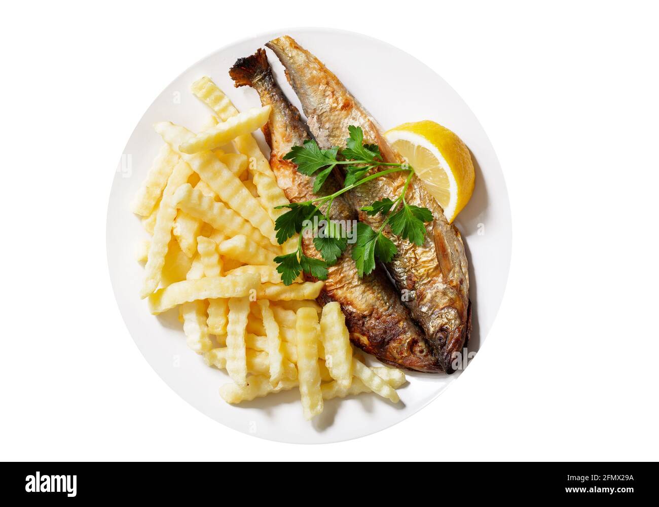plate of fried fish with french fries isolated on a white background ...