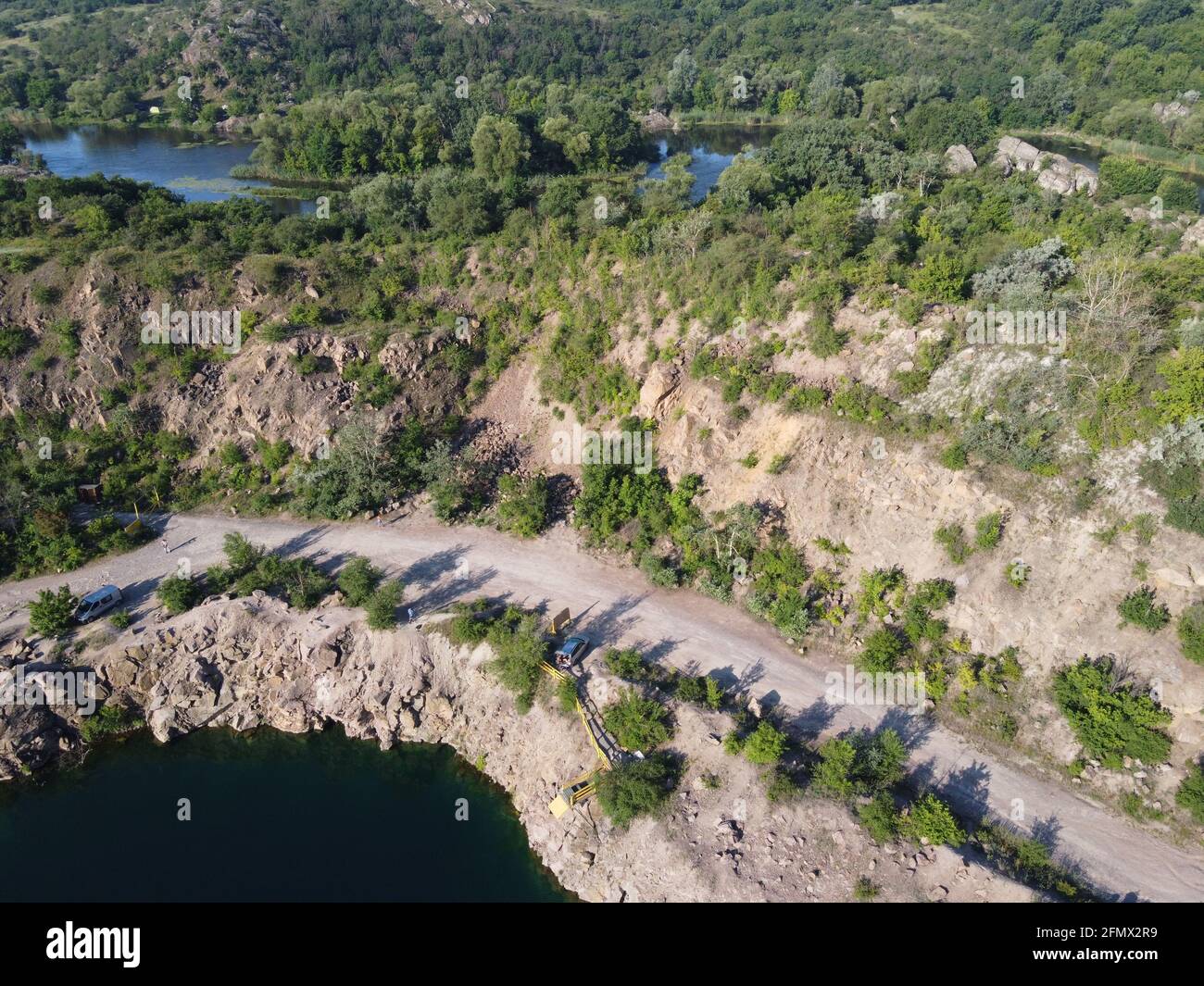 Rocky terrain overgrown with sparse vegetation, aerial view. Summer ...