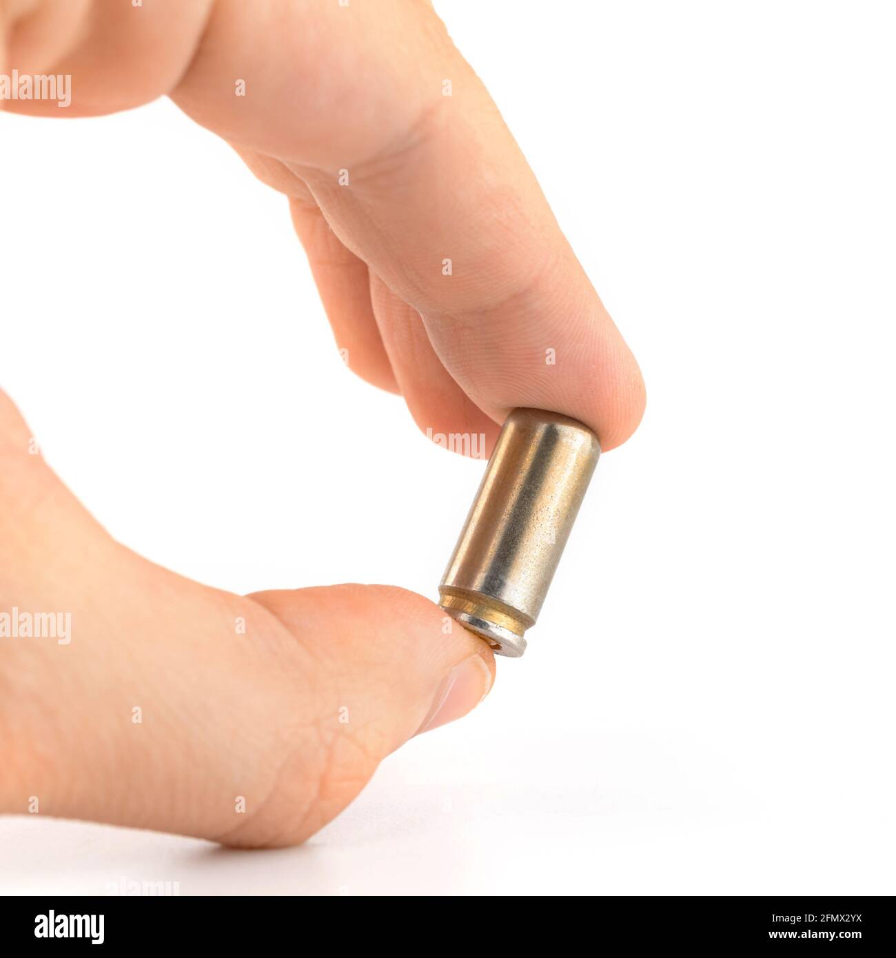 Man holds 9mm bullet in hand isolated on white background Stock Photo ...