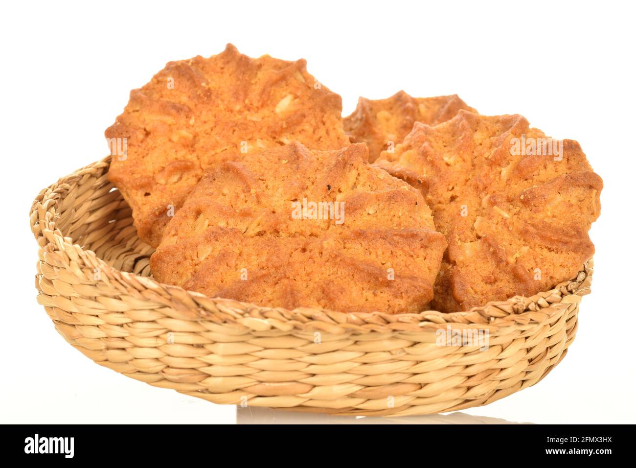 Several sweet, tasty, cereal cookies in a straw plate, close-up, on a ...