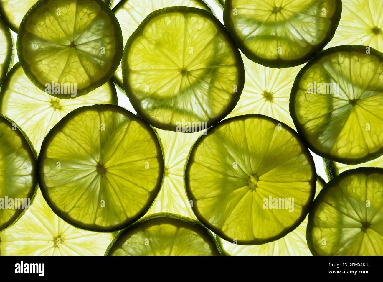 Thin slices of lime, overlapping Stock Photo - Alamy