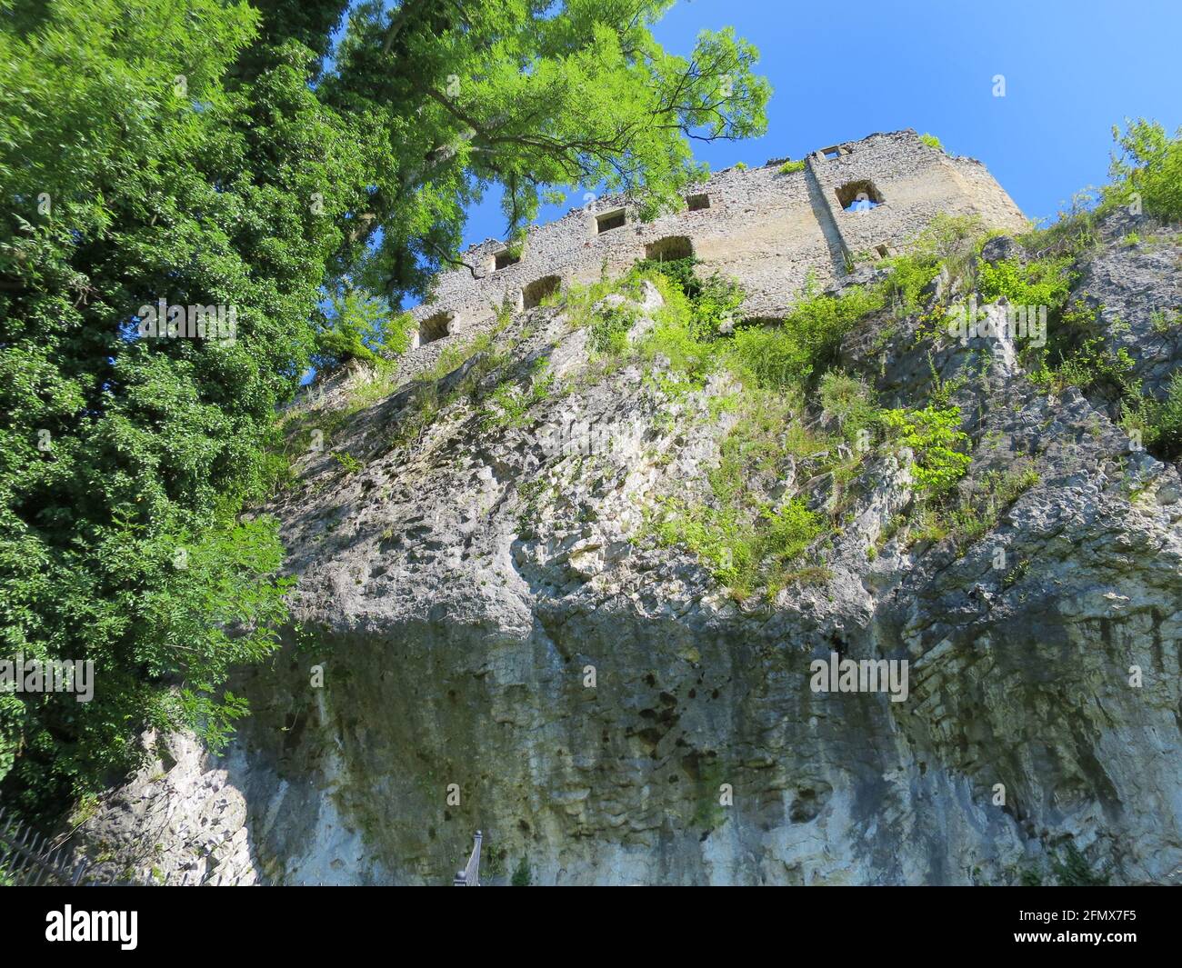 Beautiful landscape with a ruined building on the rock against a blue ...