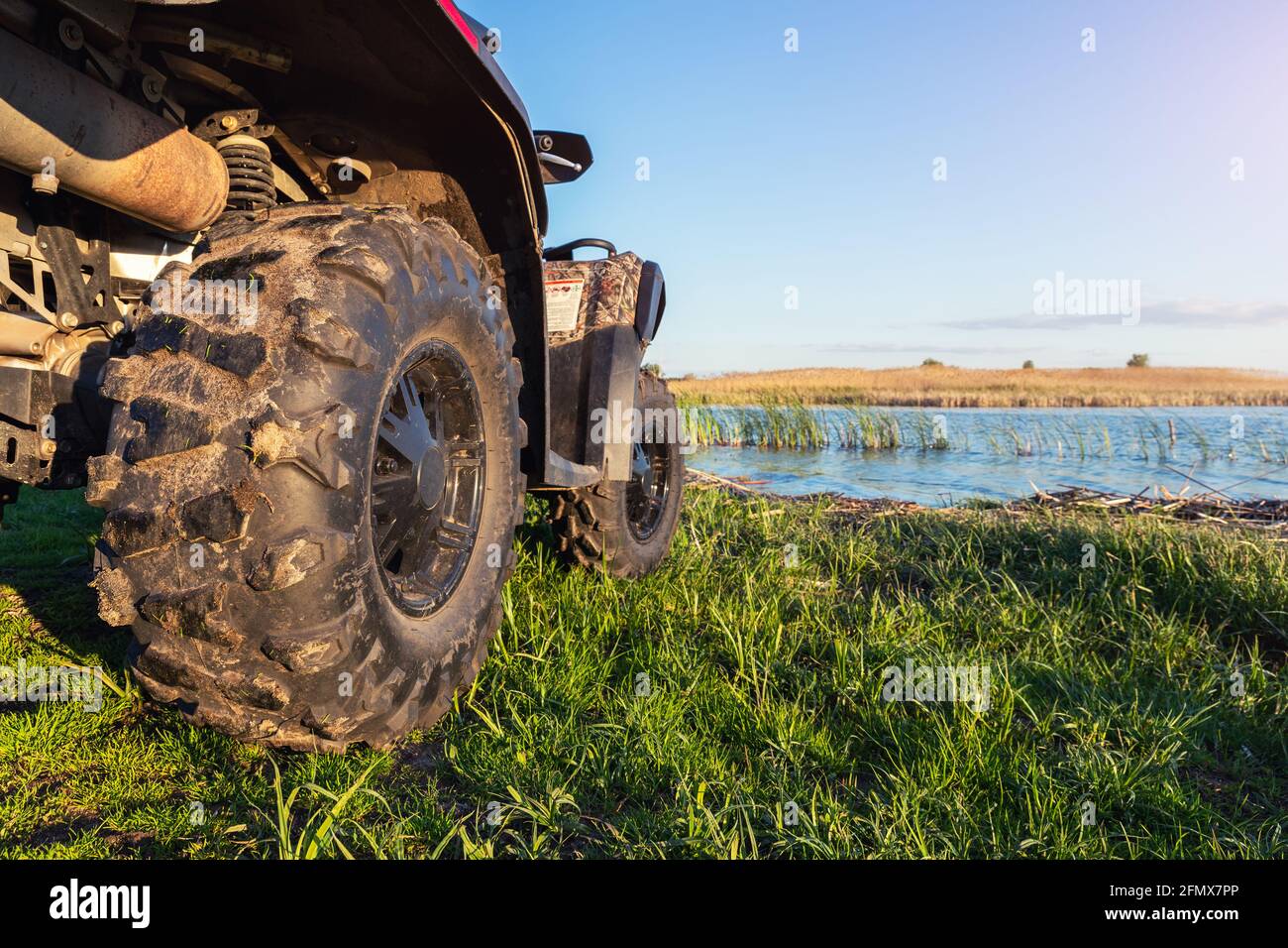 ATV awd quadbike motorcycle pov view near lake or river pond coast with ...