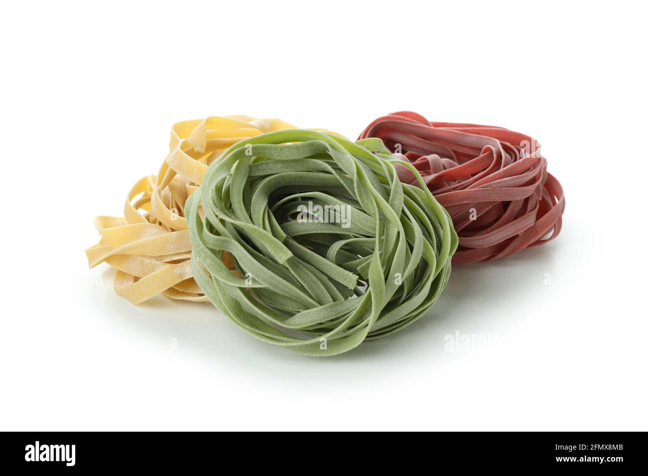 Uncooked color pasta isolated on white background Stock Photo - Alamy
