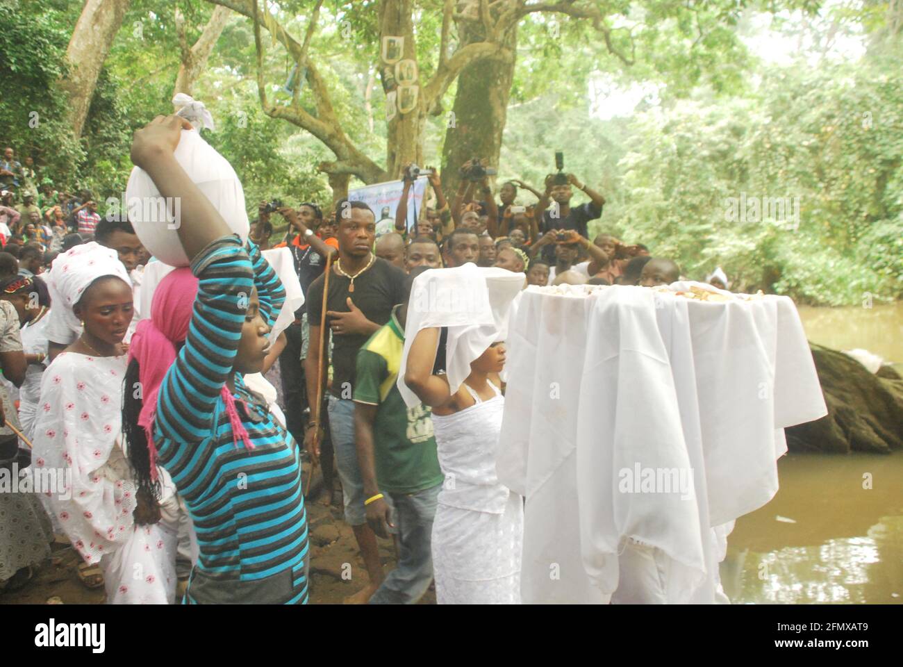 Osun Osogbo Spiritual Ecstasy: Young ladies taking a burning sacrifice ...