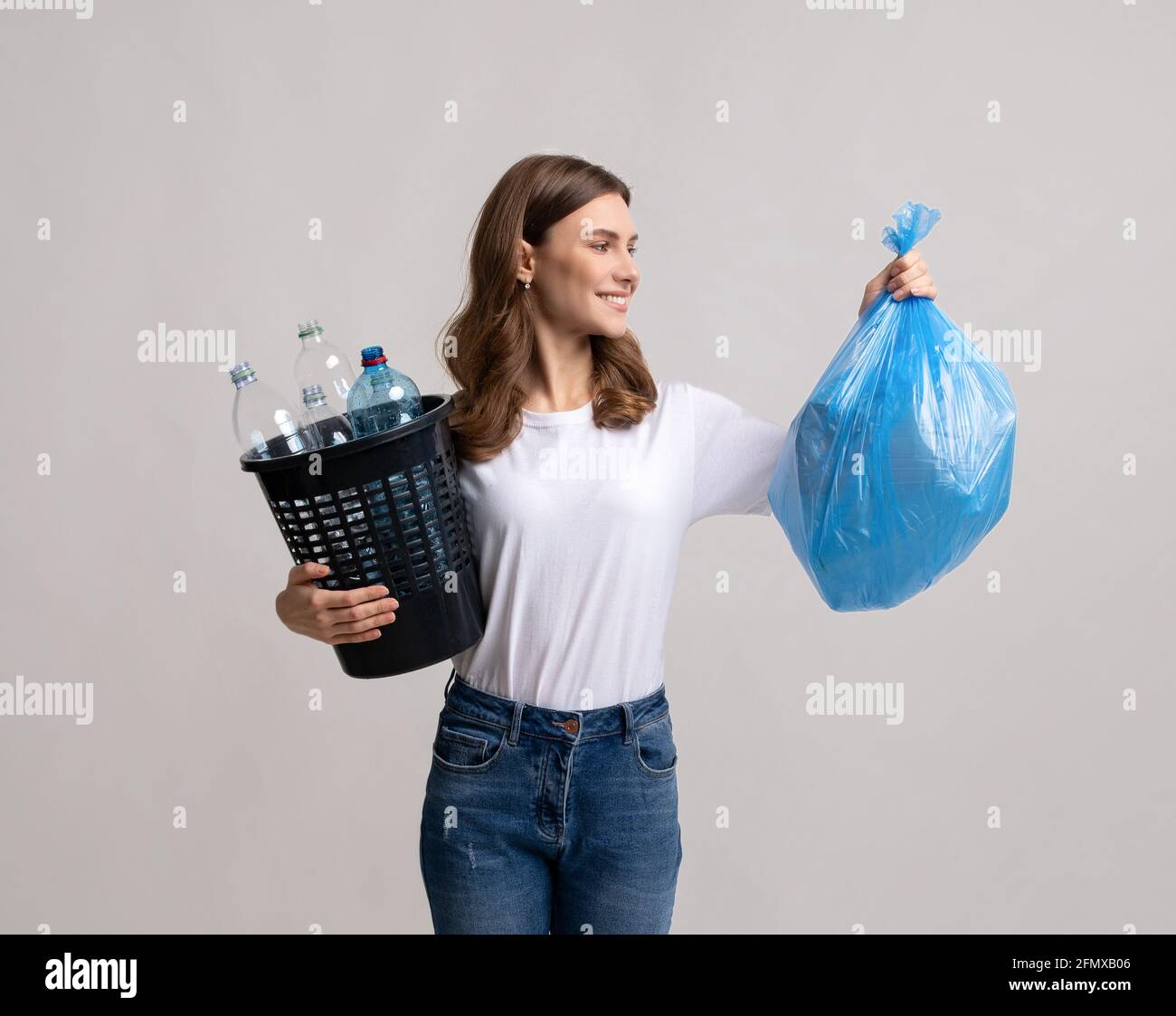 Domestic Waste Sorting. Lady Holding Garbage Bag And Bucket With ...
