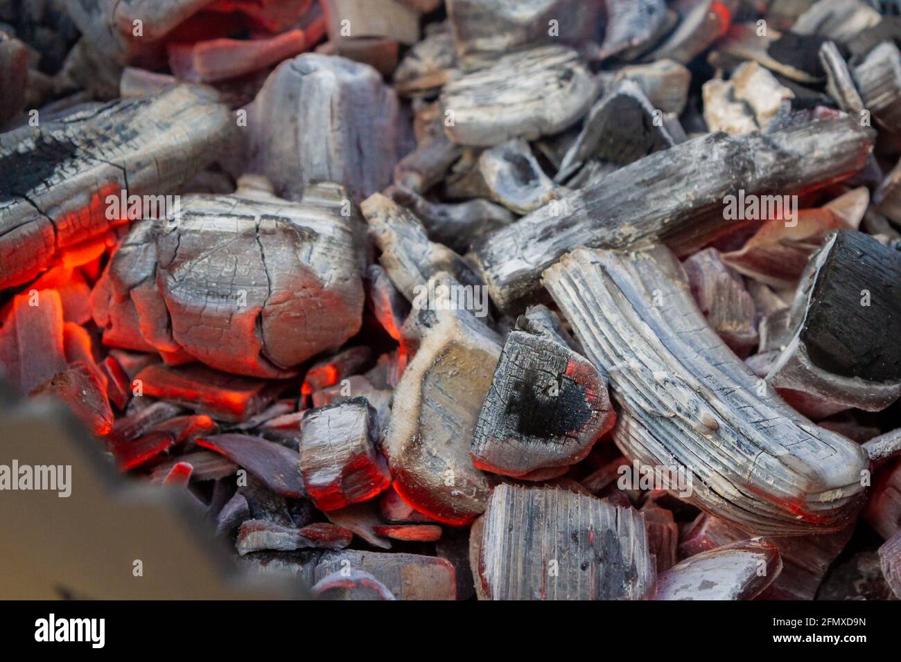 Red-hot coals lie in the barbecue grill in the spring Stock Photo - Alamy