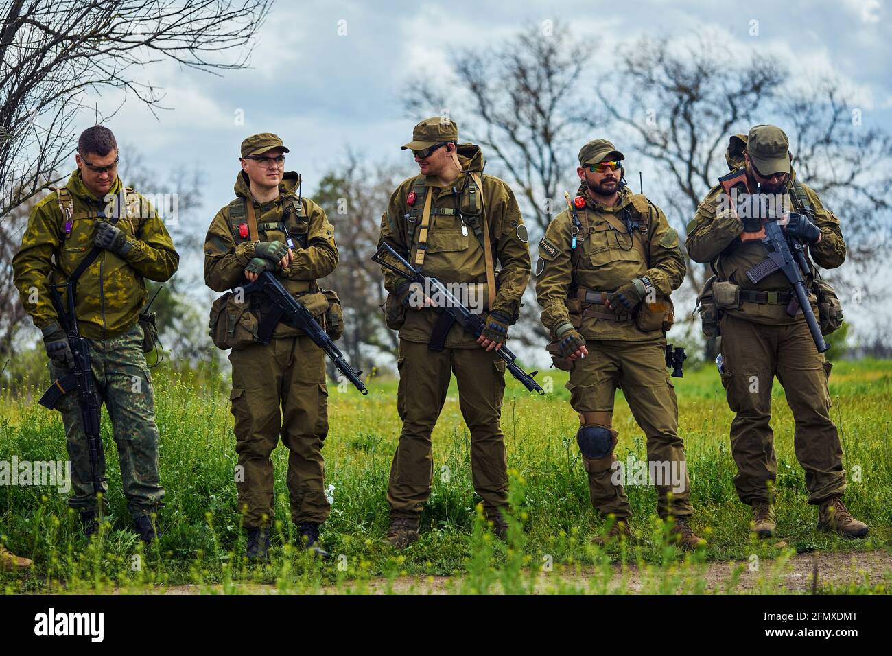 A group of airsoft players in the uniform of Russian soldiers with ...