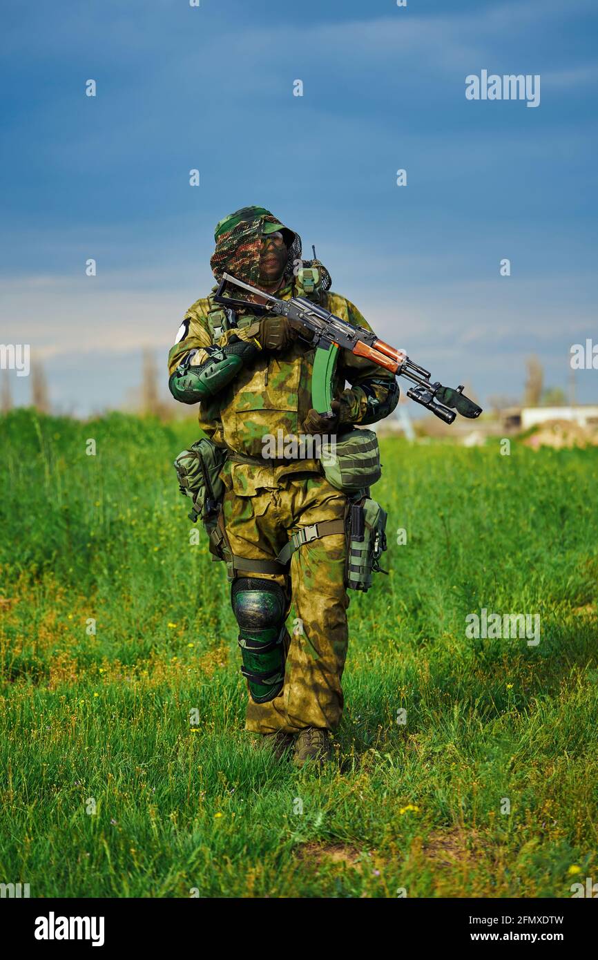 Russian soldier in military uniform holding a weapon in his hands Stock ...