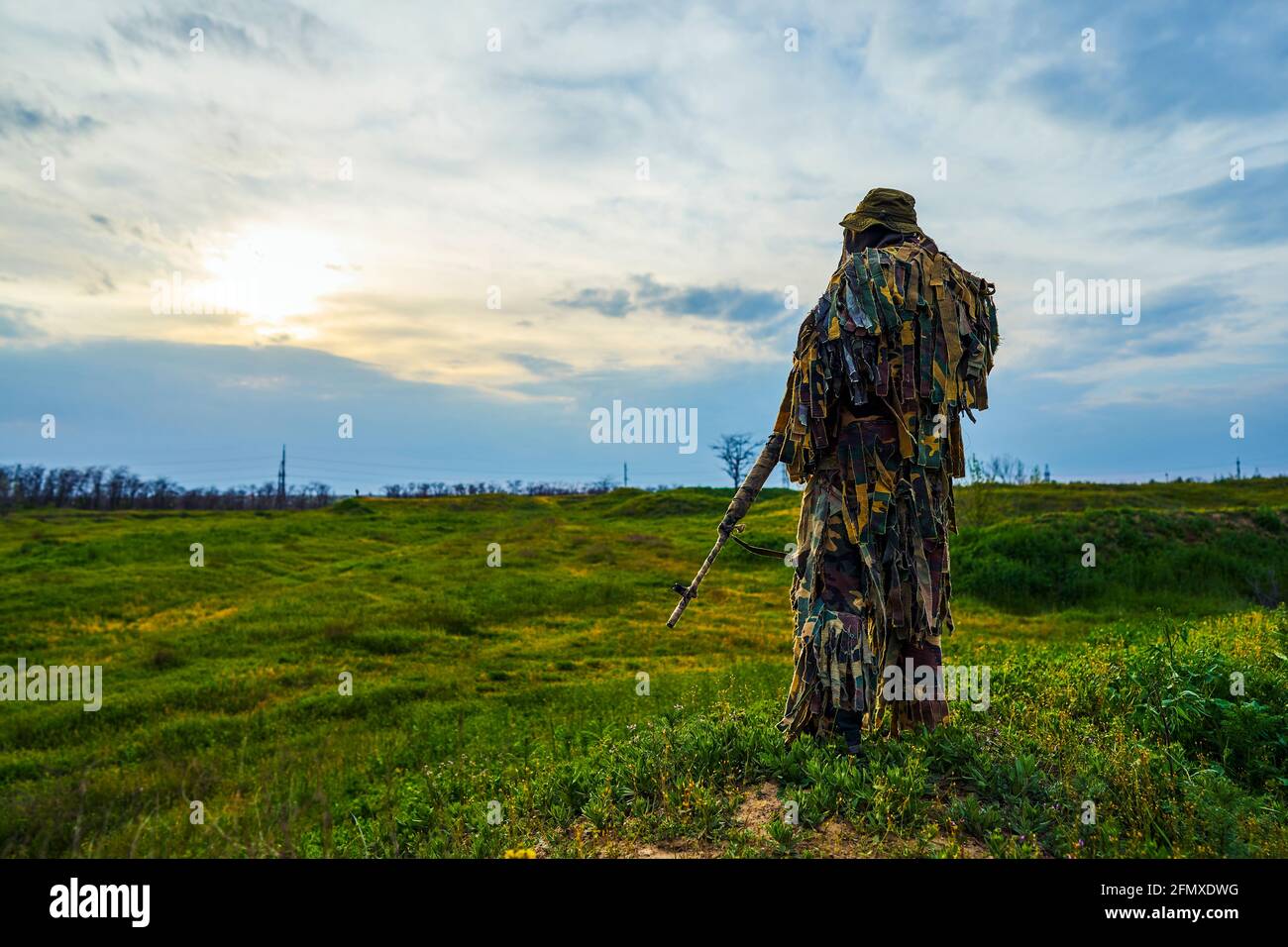 Sniper in a field with a gun hi-res stock photography and images - Alamy