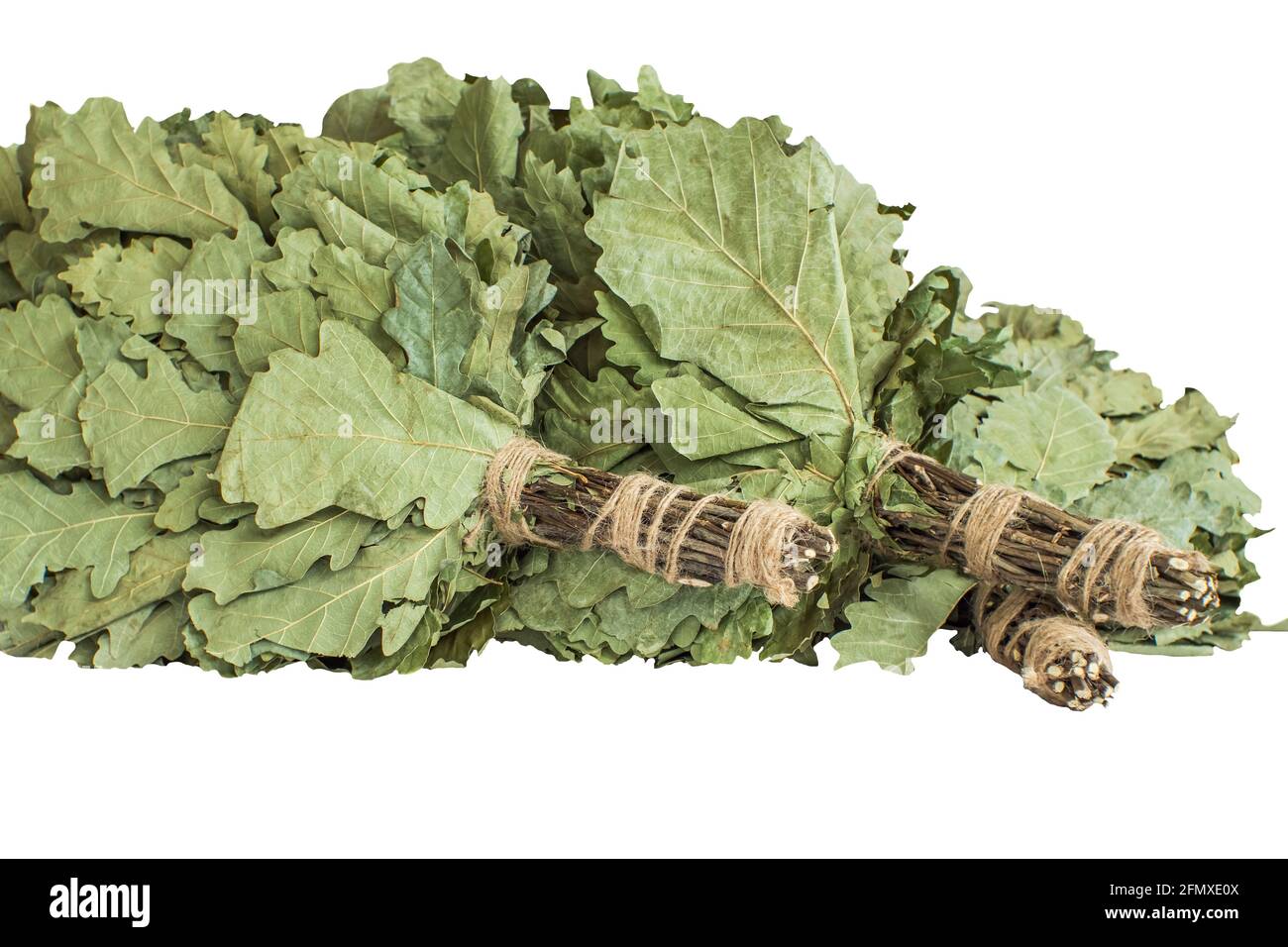 Three dry bath brooms made of oak branches isolated on a white ...