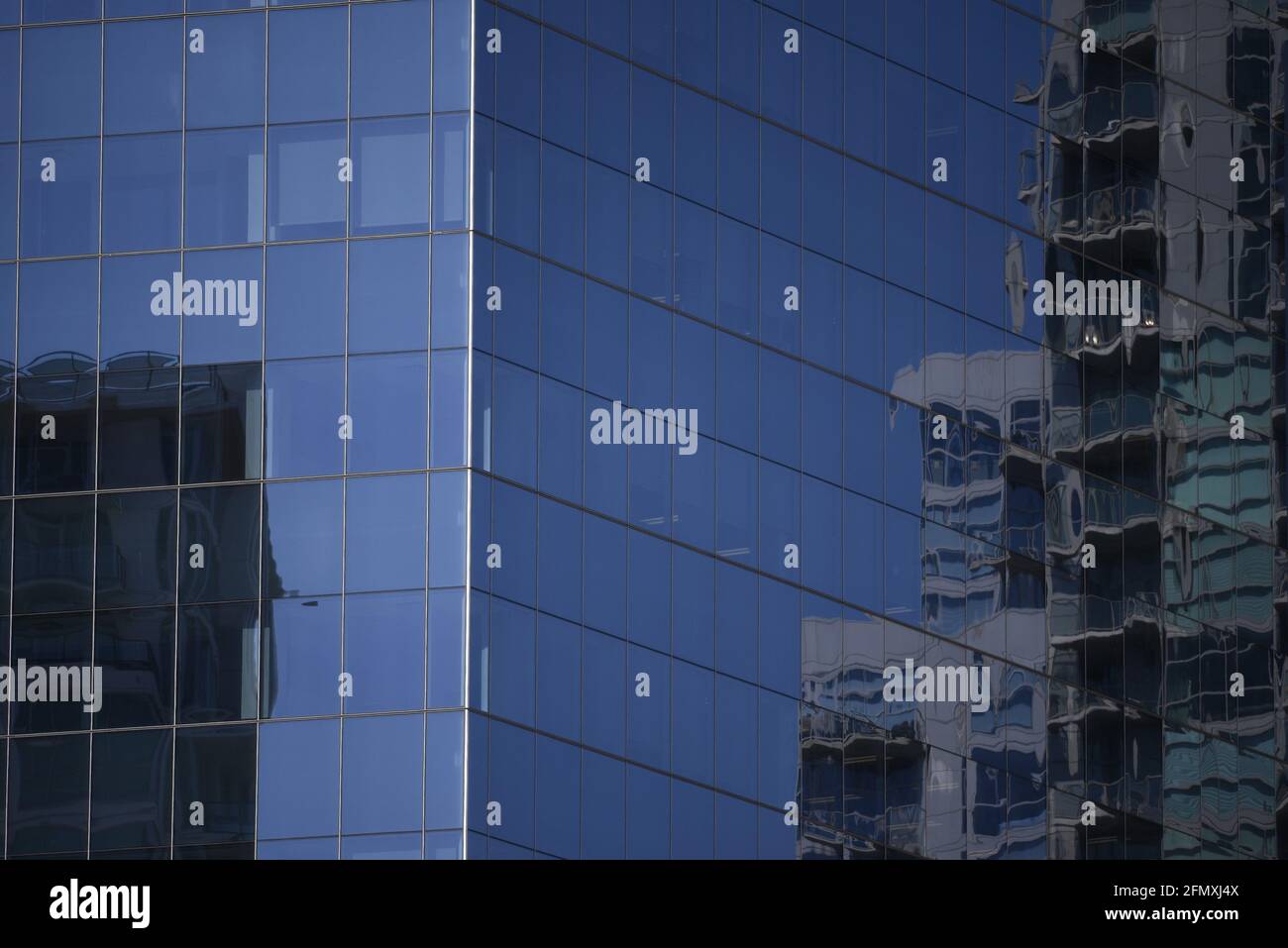Corporate offices high-rise building blue glass facade in downtown San ...