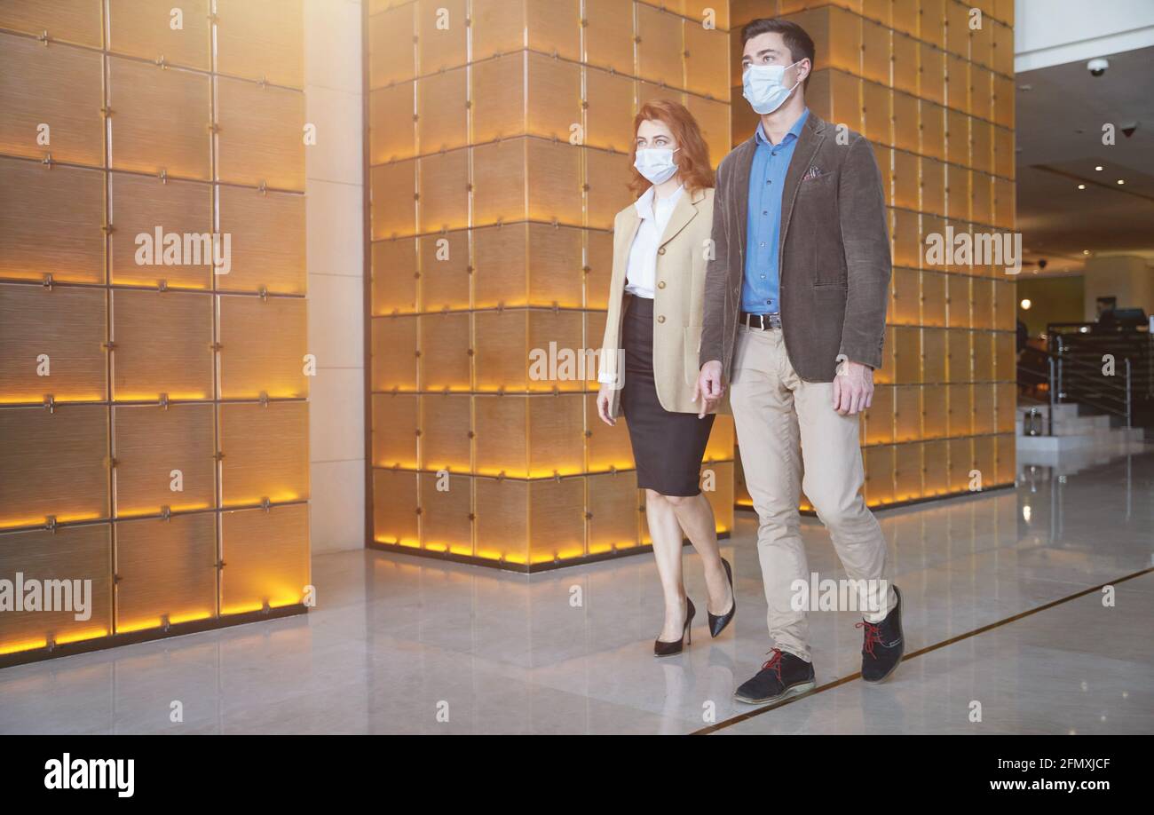 People wearing masks inside the office building Stock Photo - Alamy